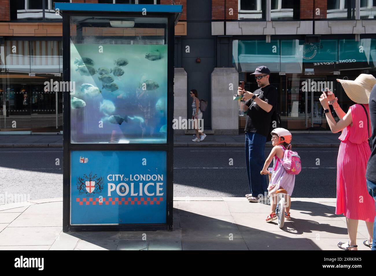 London, UK. 11th Aug, 2024. People take photos of Street Artist Banksy ...