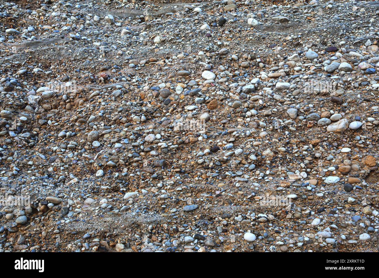 Pebbles and sand and rubble on the floor Stock Photo - Alamy
