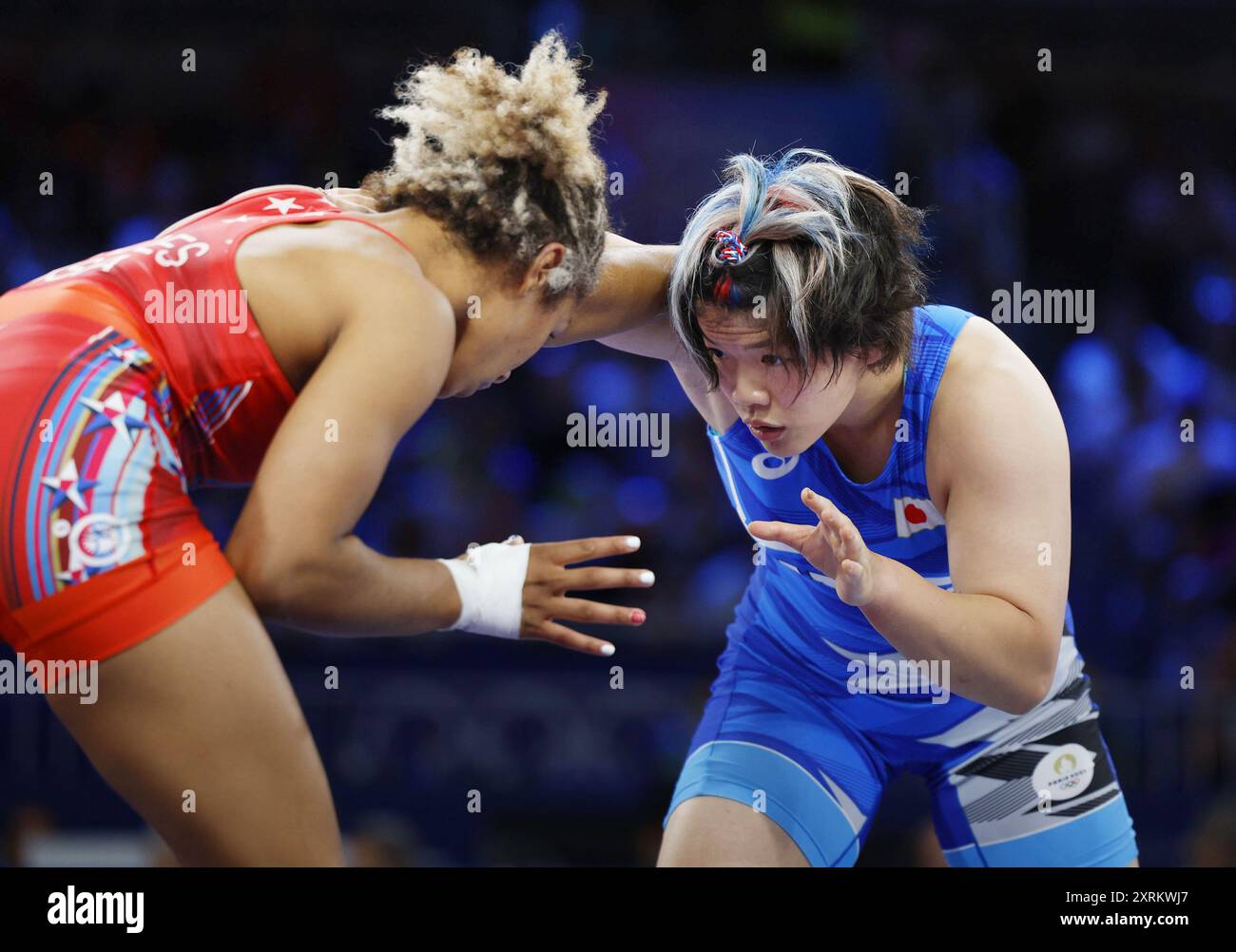 Japan's Yuka Kagami (blue) competes against Kennedy Alexis Blades of ...