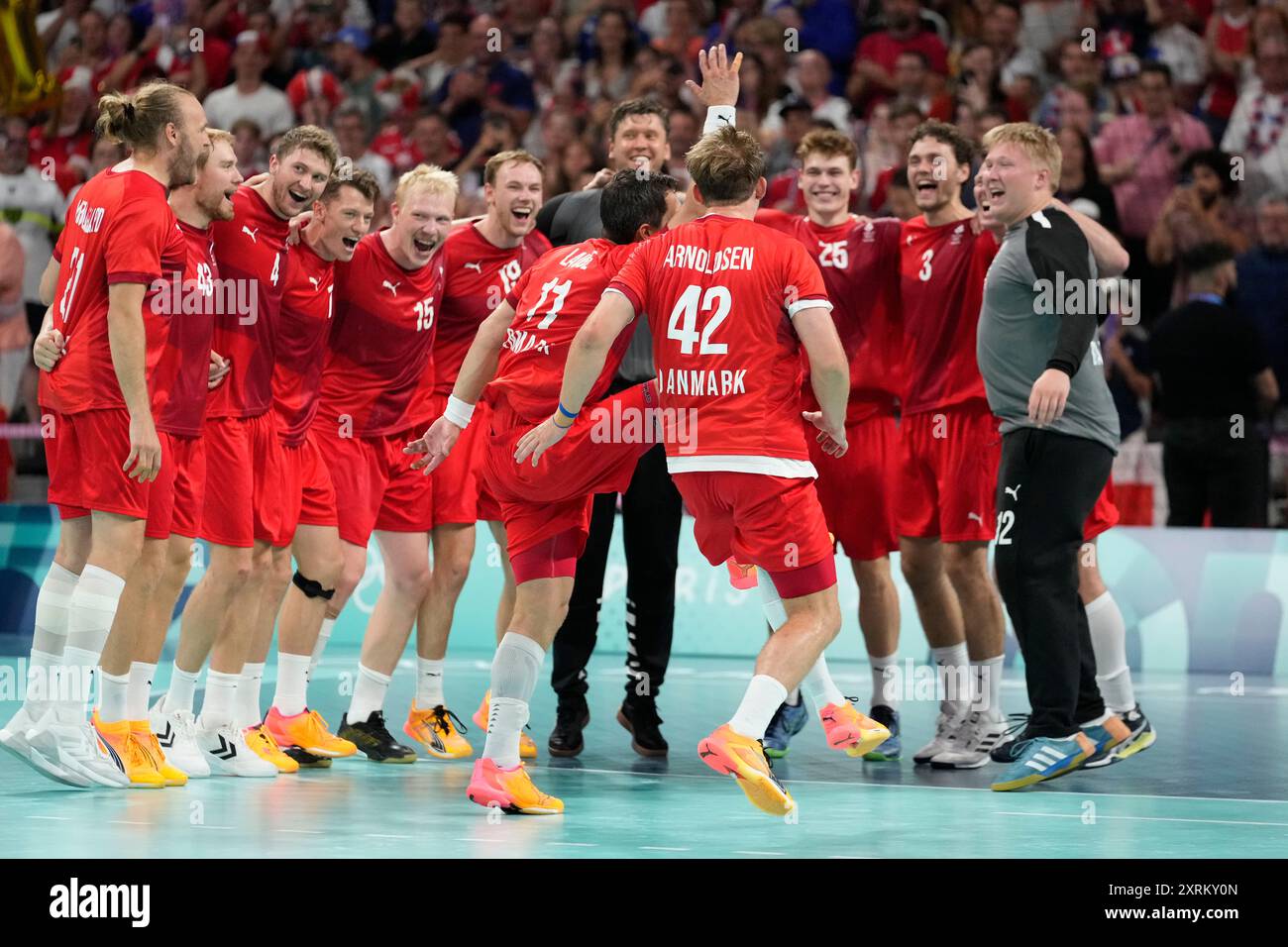 Denmark players celebrate their victory after the gold medal handball ...