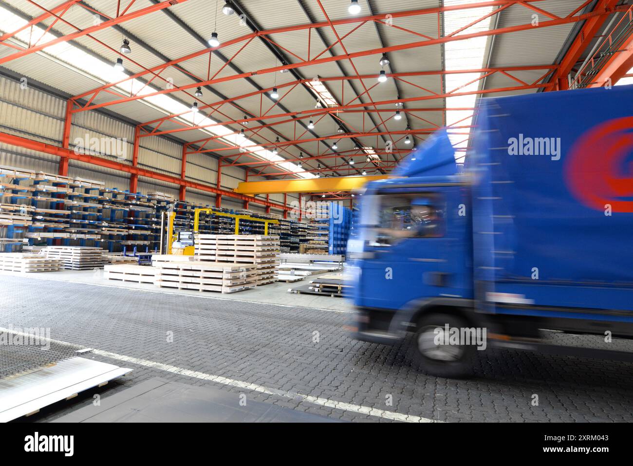 Sale and storage of industrial goods and steel in a factory hall Stock ...