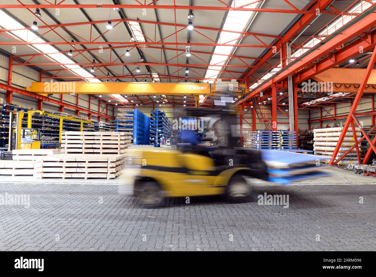 Sale and storage of industrial goods and steel in a factory hall Stock ...