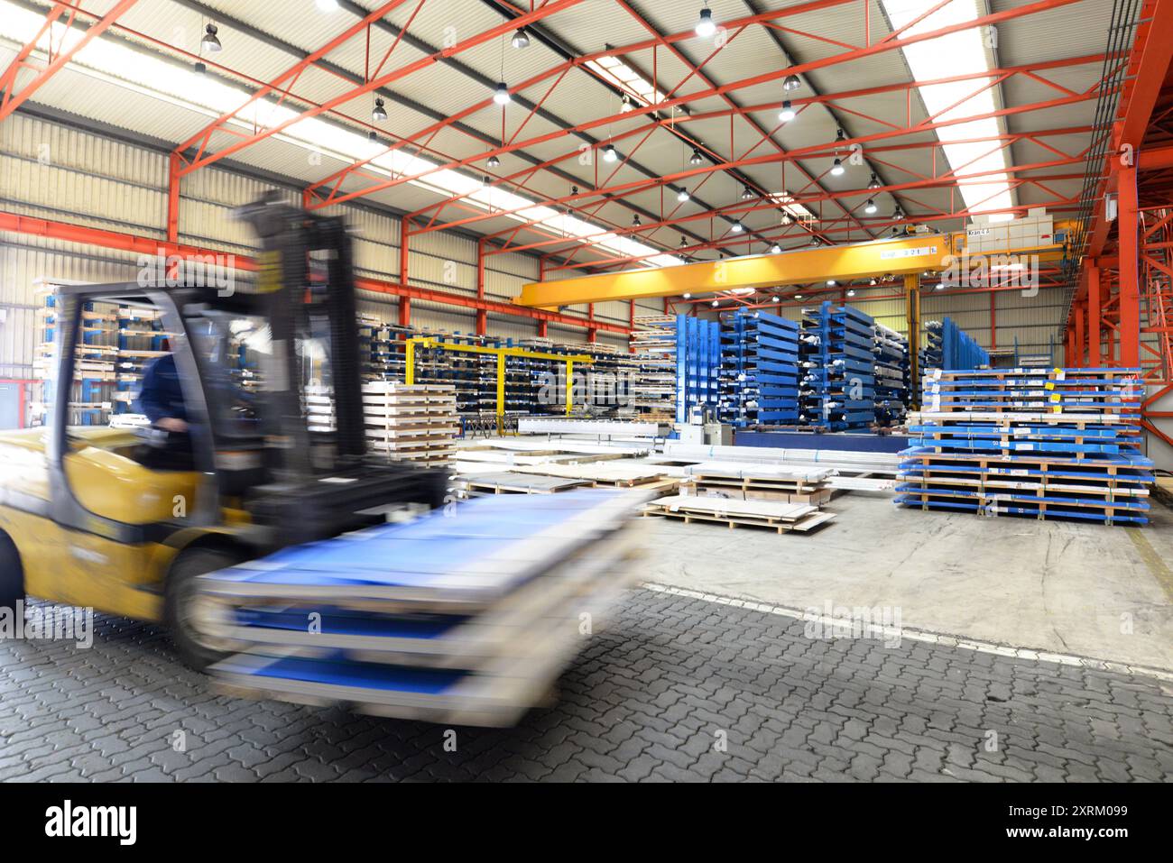 Sale and storage of industrial goods and steel in a factory hall Stock ...