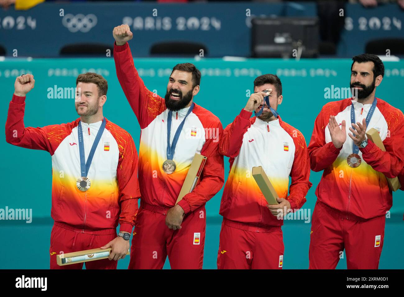 Spain players celebrate their bronze medal after the gold medal ...