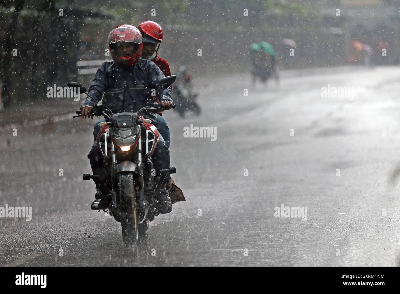 The rush of life during the rain of in the capital Maolana Bhasani Road, Dhaka, Bangladesh, July ...