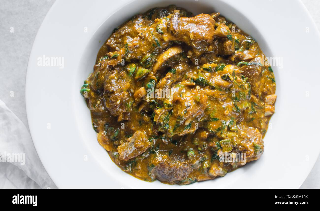 Overhead view of nigerian ogbono soup in a white plate, top view of ...