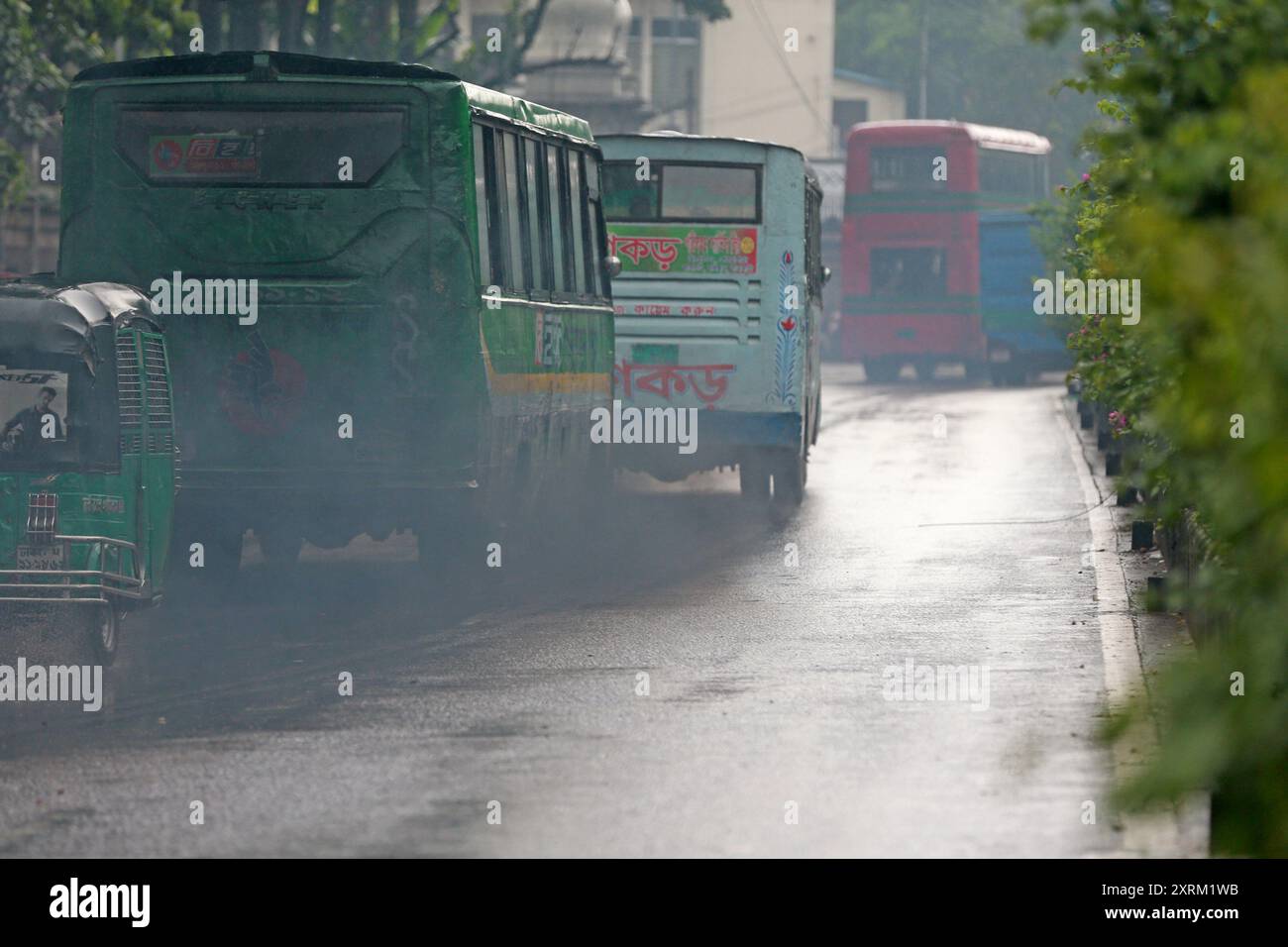 A public bus exhaust black smoke on a road at Moulana Bhasani Road ...