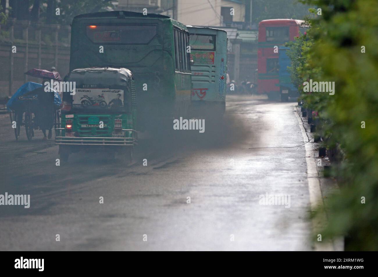 A public bus exhaust black smoke on a road at Moulana Bhasani Road ...