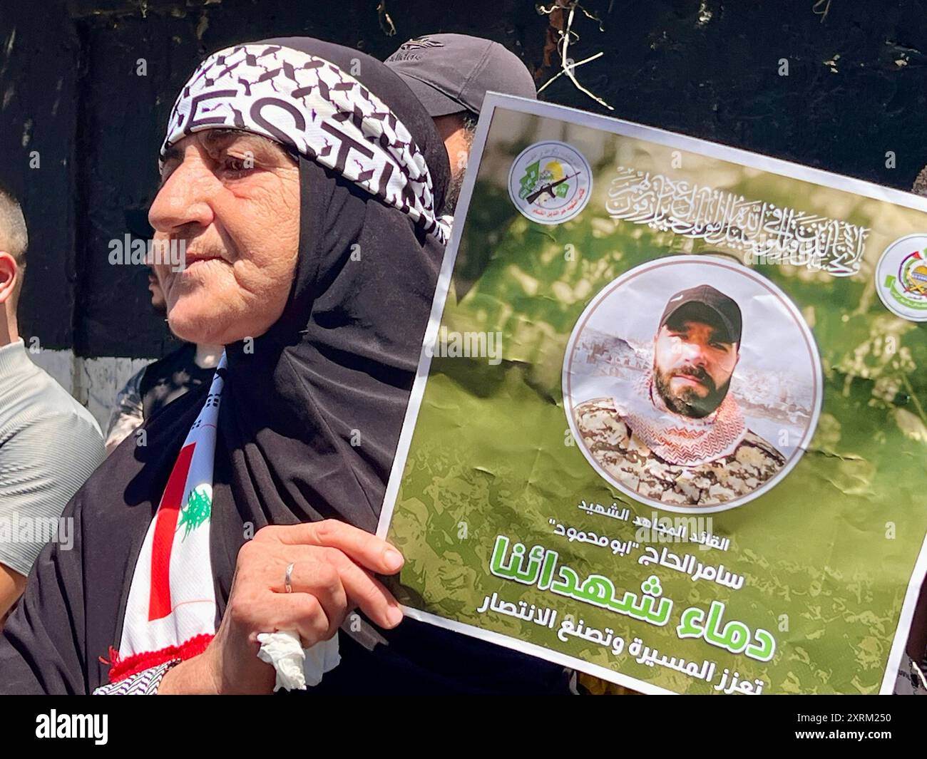 Sidon. 10th Aug, 2024. A woman attends the funeral of Samer al-Hajj, a ...
