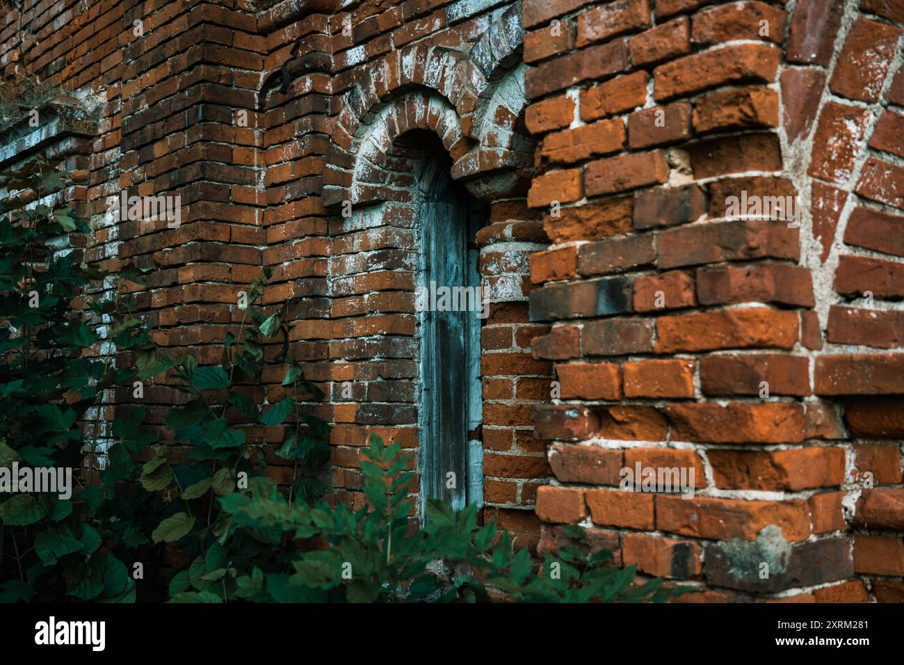 A vertical window in a brick stable. 19th century buildings Stock Photo ...