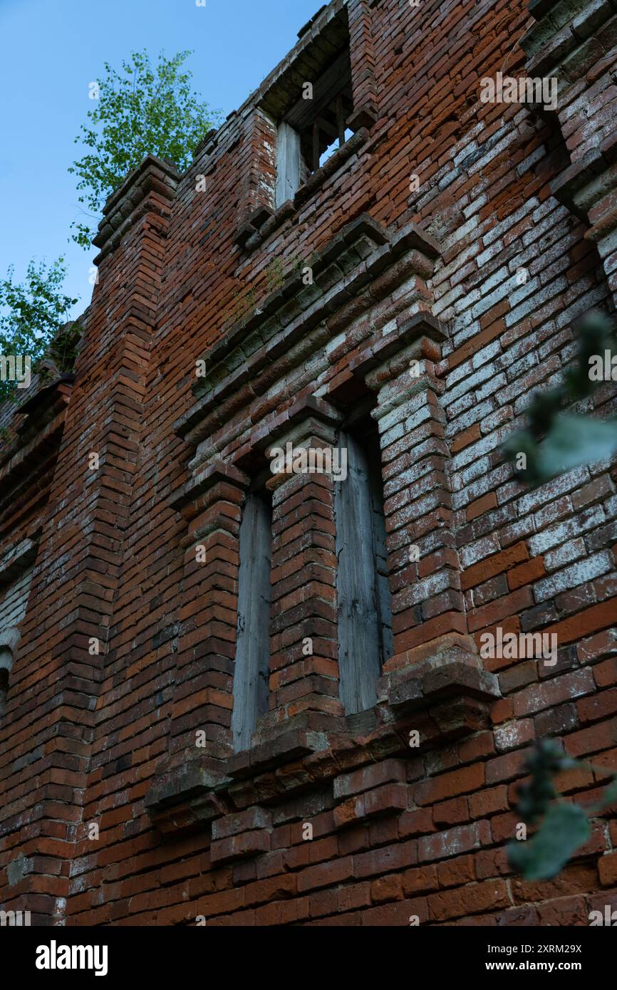 Vertical windows in an old brick building Stock Photo - Alamy