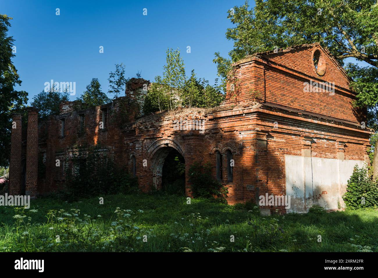 A ruined red brick stable. The Kostrovitsky manor house. 19th century ...