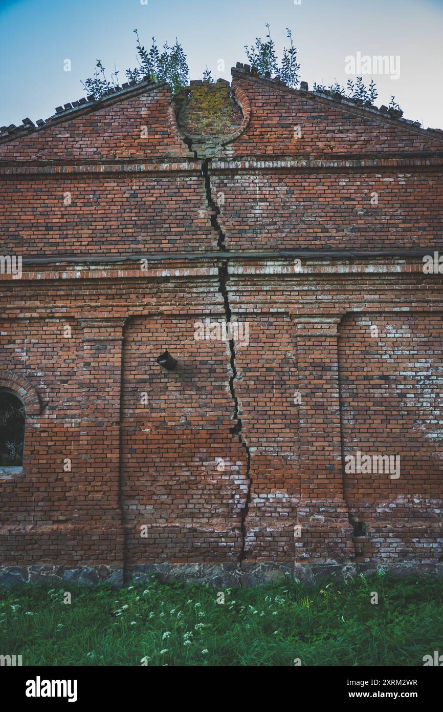 A crack in the wall of a brick building. The stable. 19th century ...