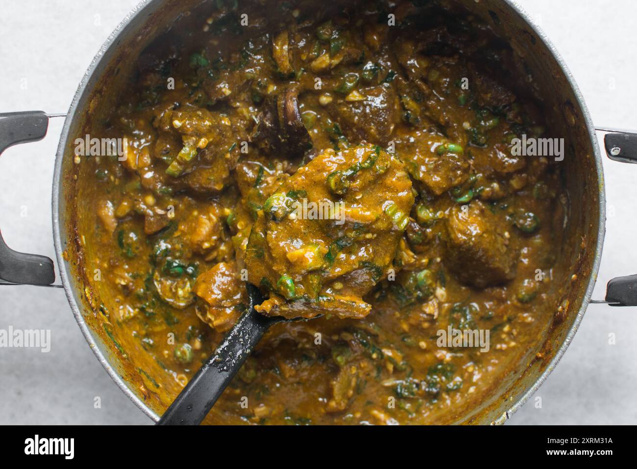 Overhead view of nigerian ogbono soup in a pot, top view of ogbono draw ...