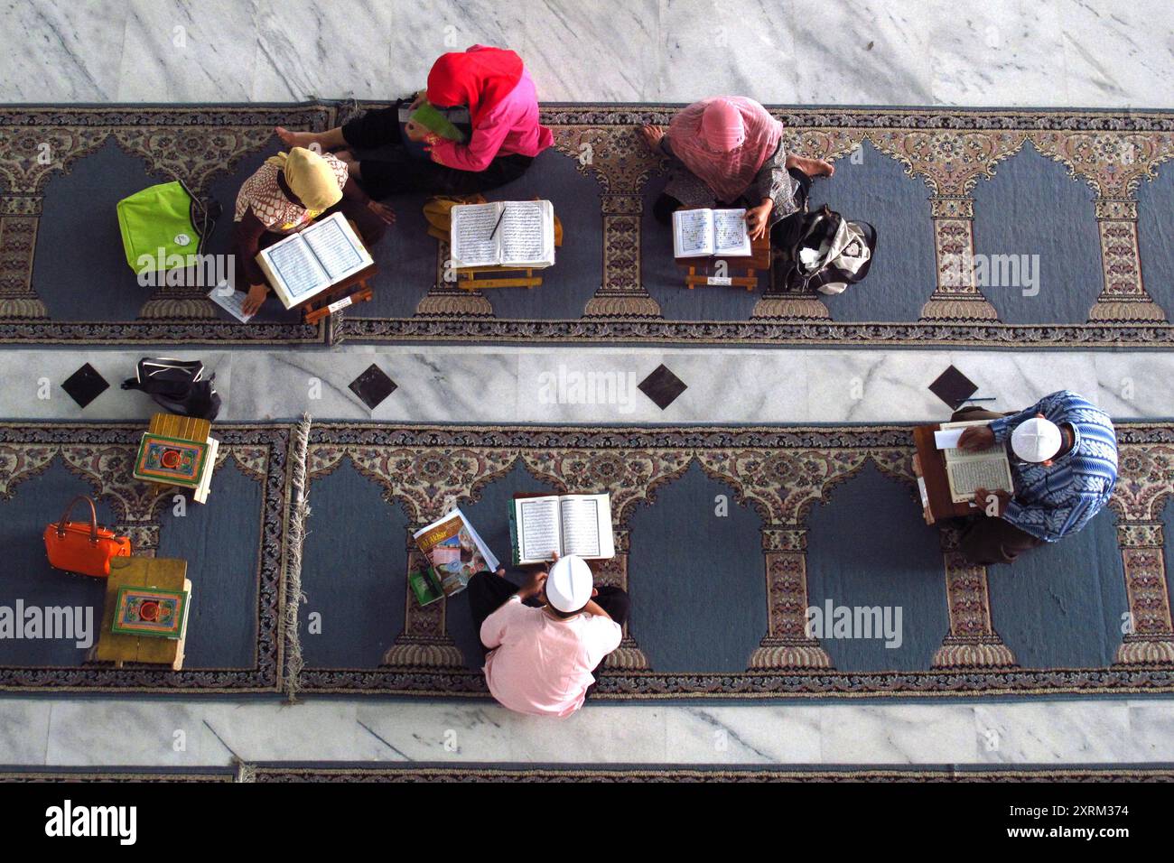 view from above of Muslim children reciting the Koran in the mosque ...