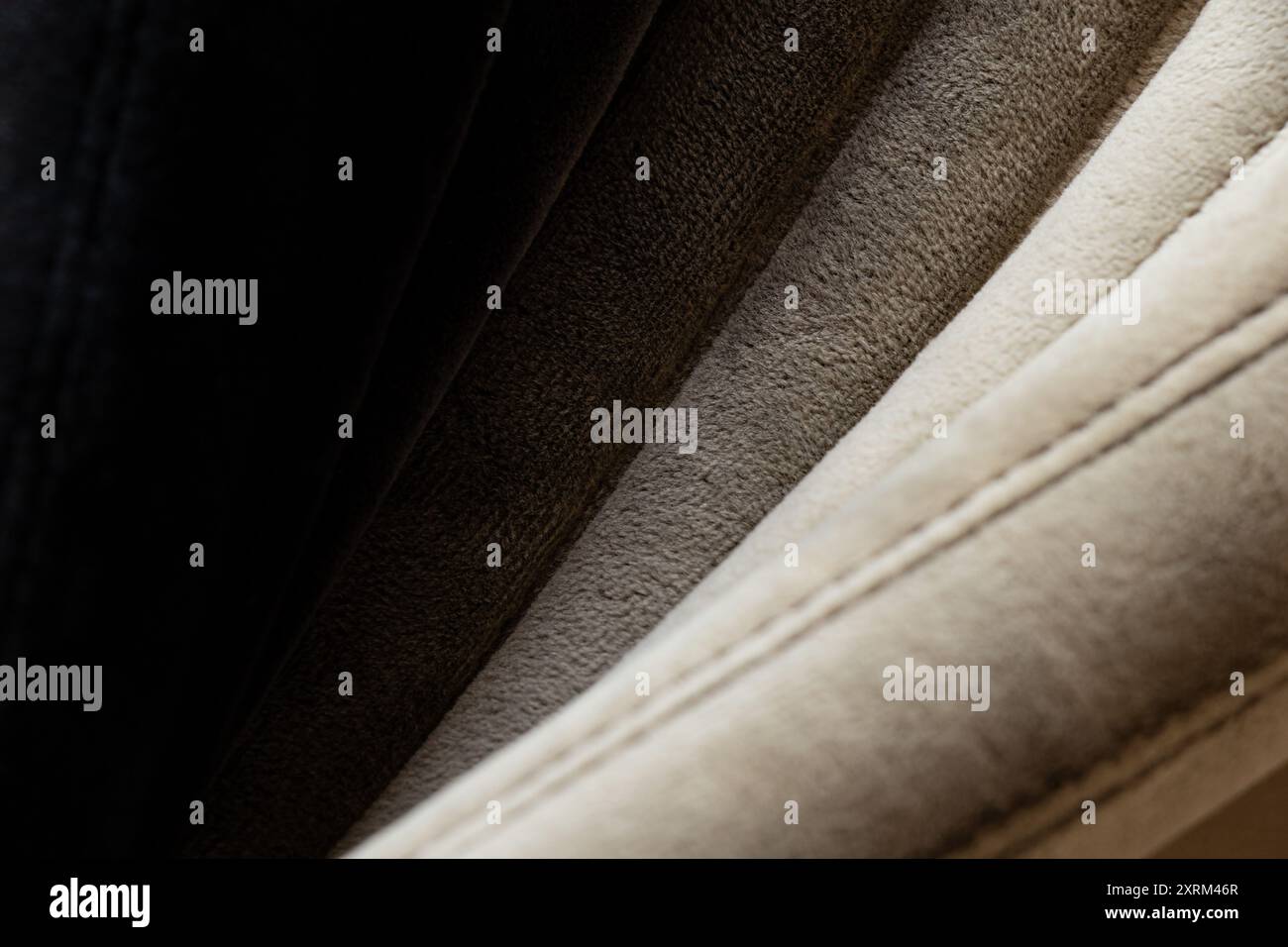 Black with transition to gray striped soft suede fabric as a background ...