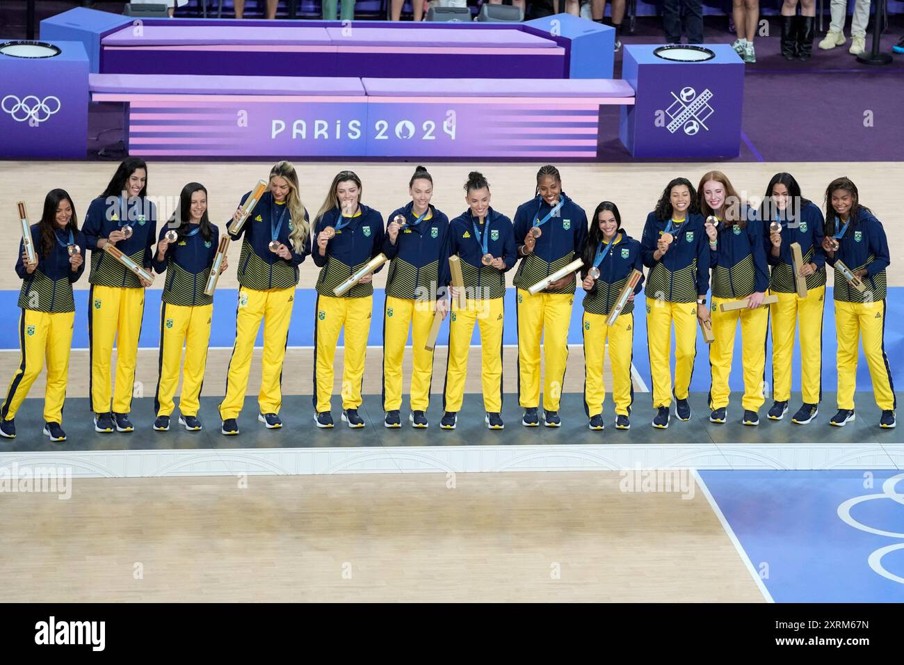 Players of Brazil show their bronze medals on the podium during the ...