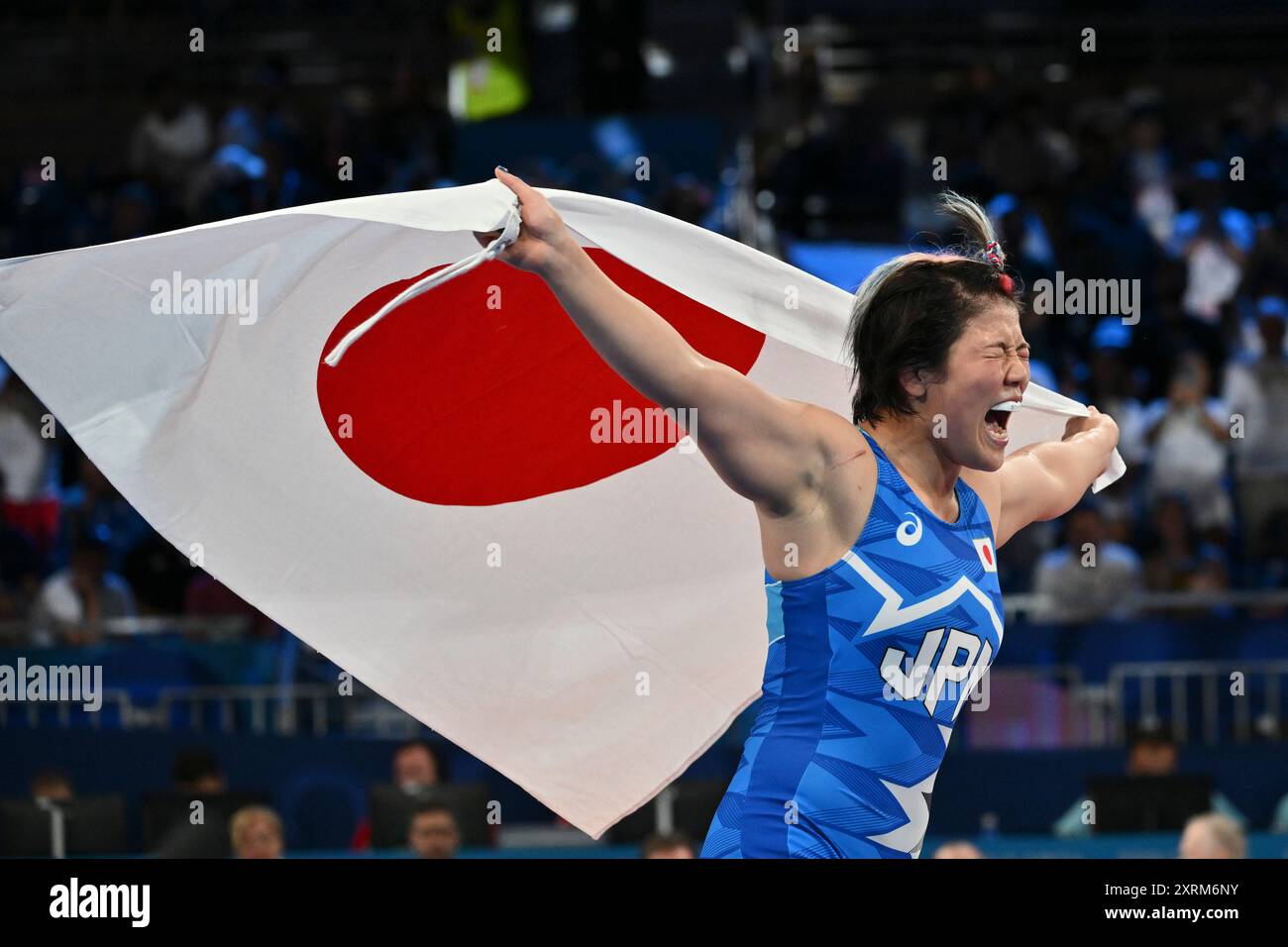 CAGAMI Yuka (JPN) Japan celebrating the gold medal with the Japan flag, Wrestling Women's ...