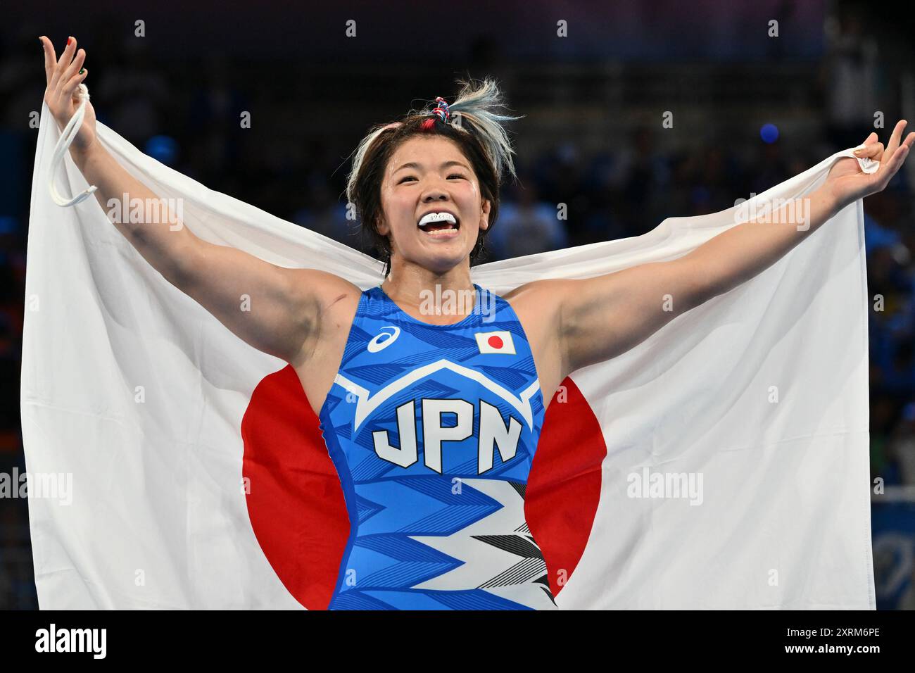 CAGAMI Yuka (JPN) Japan celebrating the gold medal with the Japan flag, Wrestling Women's ...