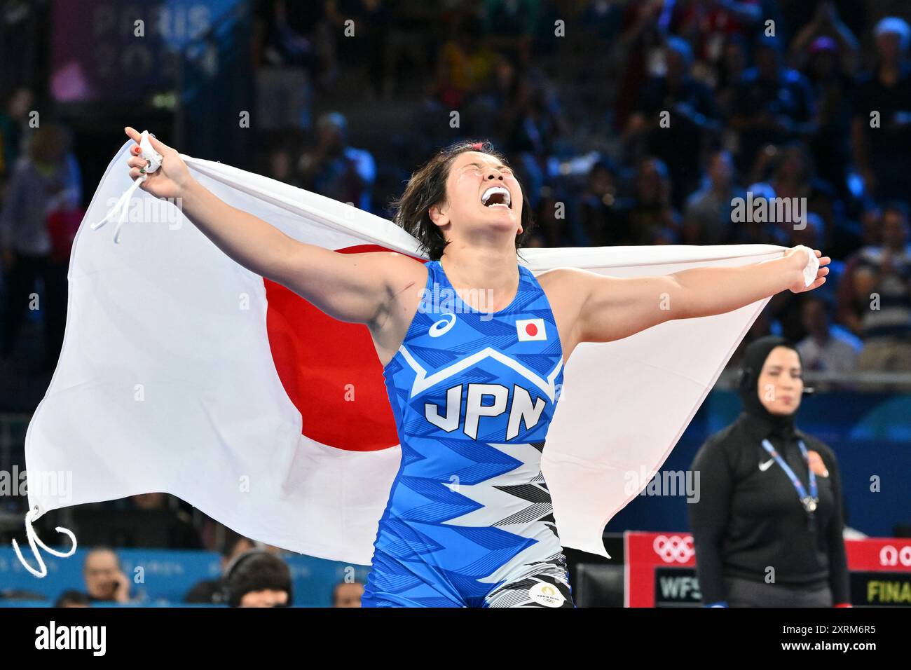 CAGAMI Yuka (JPN) Japan celebrating the gold medal with the Japan flag, Wrestling Women's ...
