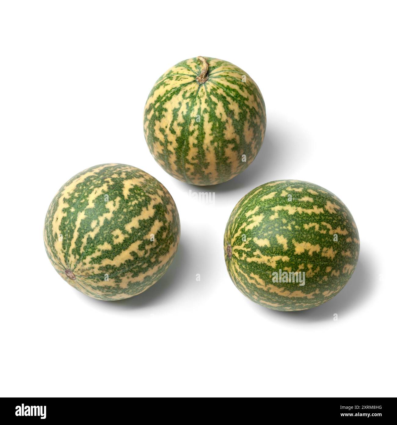 Three fresh red seeded citron melon isolated on white background close ...
