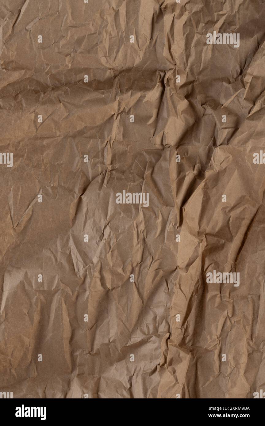 Creased brown paper background with many lines macro close up view ...