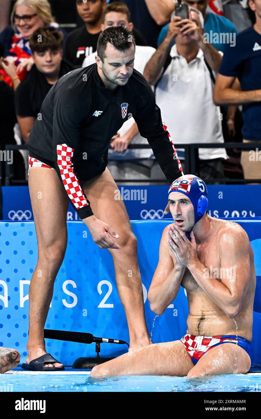 Athletes of team Croatia react after losing the water polo men gold ...