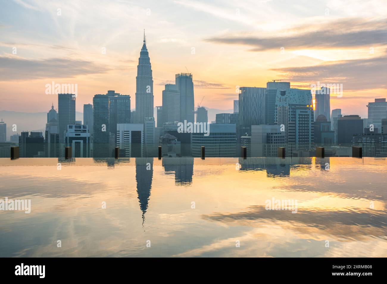 Kuala Lumpur city skyline with reflections of high-rise buildings and ...