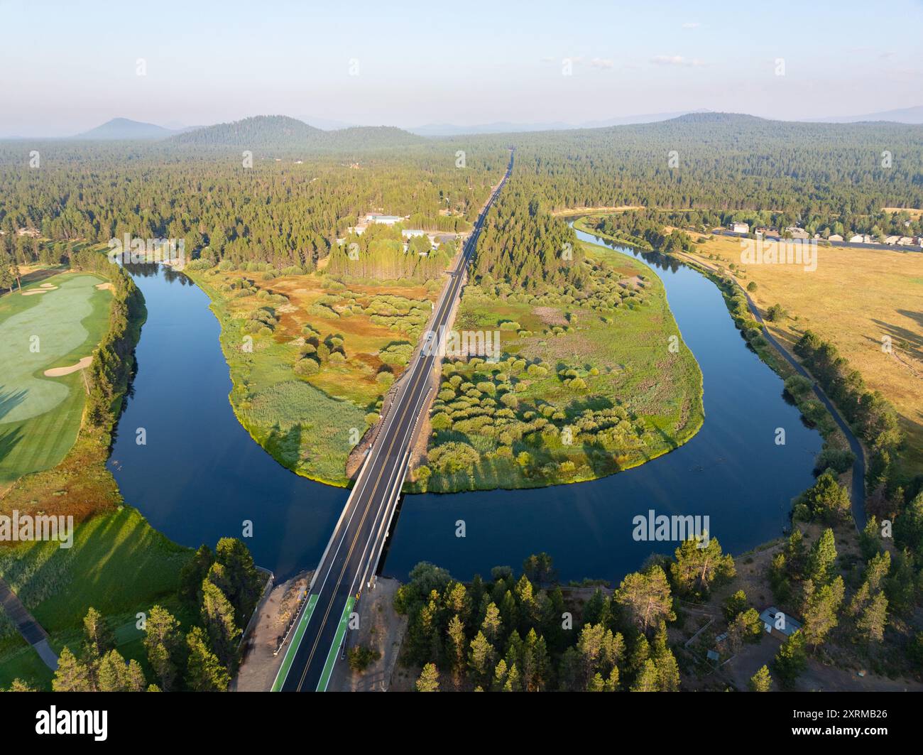 The beautiful Deschutes River winds through the rural landscape near ...