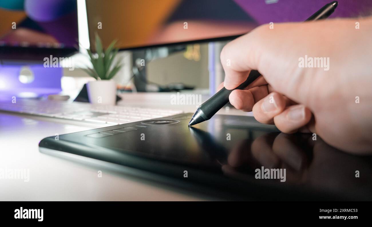 Graphic designer studio equipment. Hand holding digital pen. Home ...
