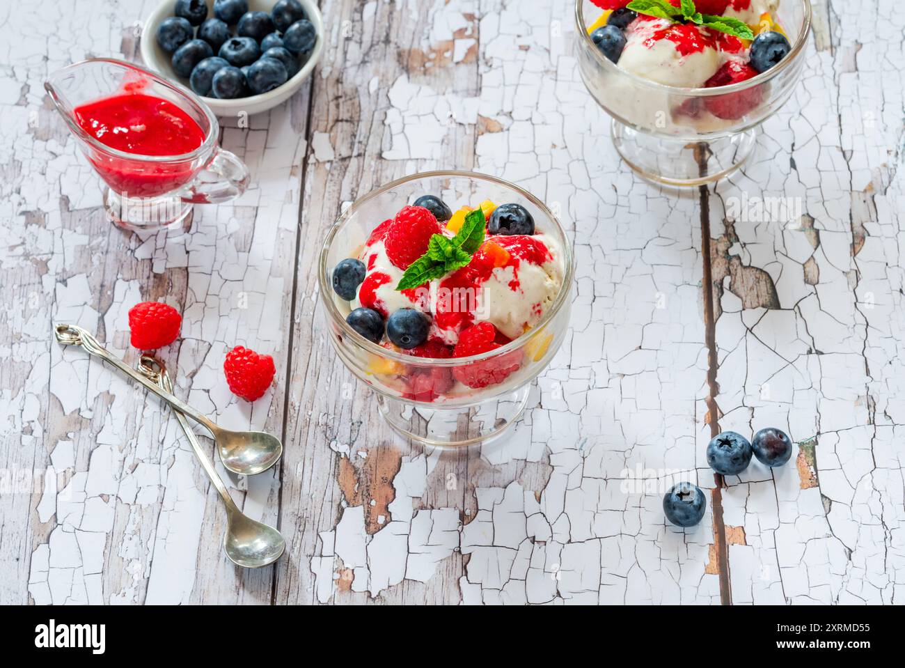 Vanilla ice cream dessert with fresh fruit and raspberry coulis Stock ...