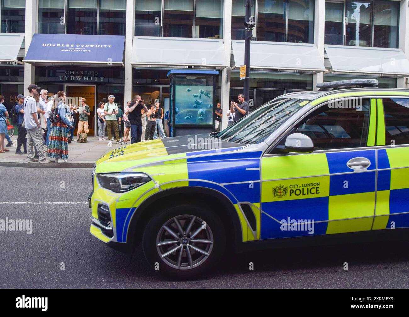 London, UK. 11th August 2024. A police car passes by the new Banksy ...