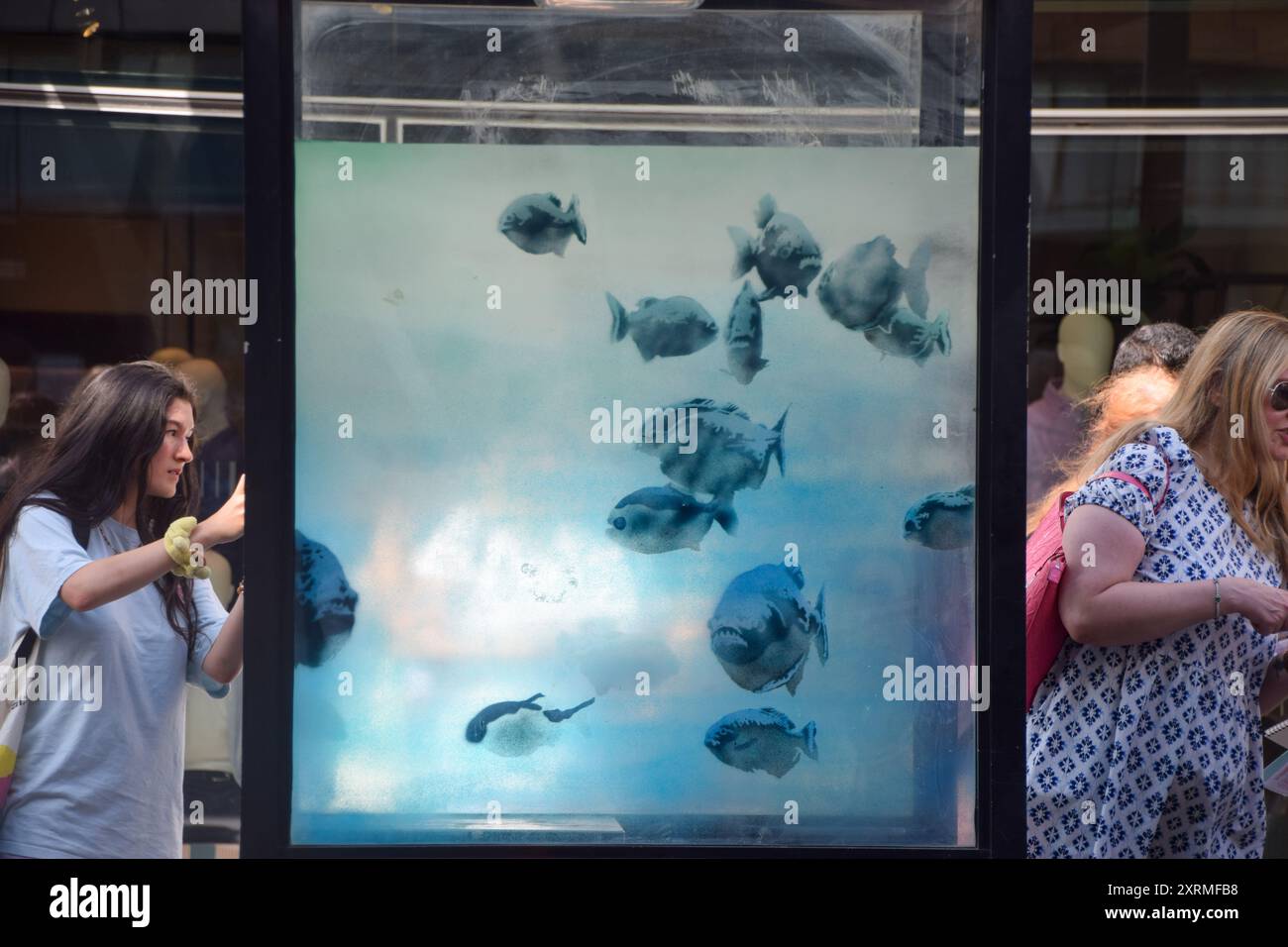London, UK. 11th August 2024. Crowds gather around the new Banksy ...