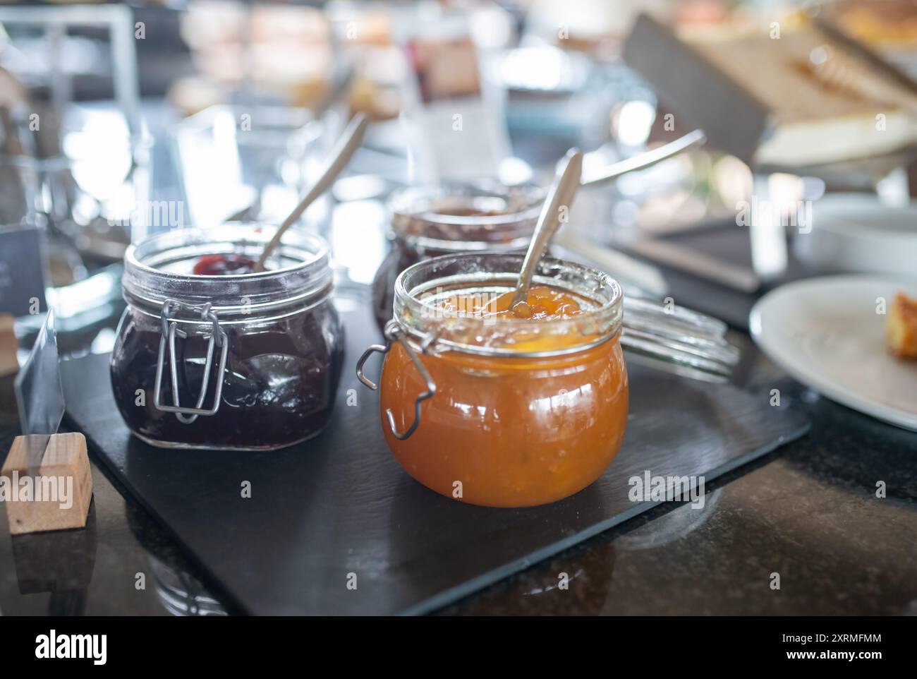 Jam jars in a buffet, sweet breakfast concept Stock Photo - Alamy
