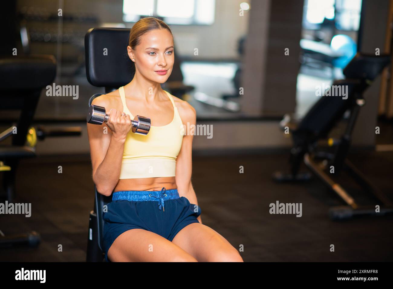 Portrait of a woman working out in a gym Stock Photo - Alamy