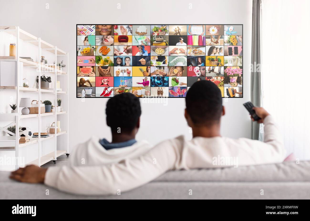 Two Men Watching Television With a Grid of Images Stock Photo - Alamy
