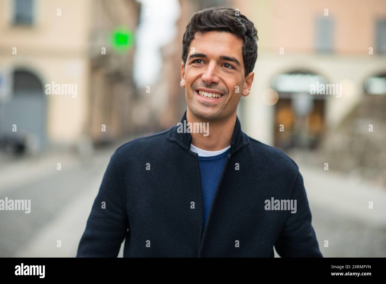 Smiling young man walking hi-res stock photography and images - Alamy
