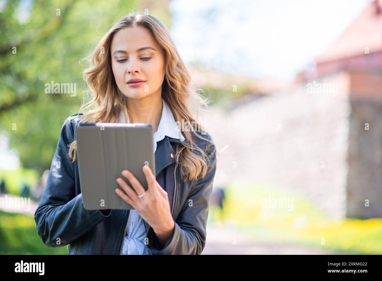 Girl tablet in park hi-res stock photography and images - Alamy