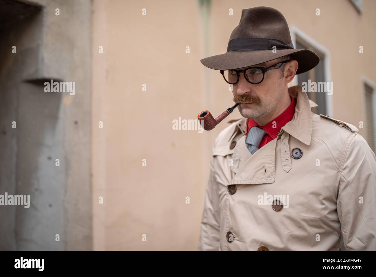 Detective smoking his pipe while walking in a skid row Stock Photo - Alamy