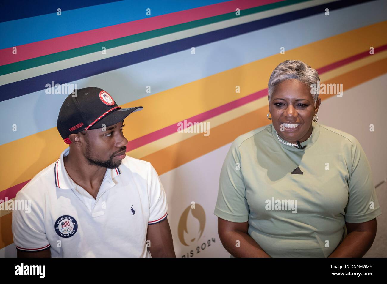 American Olympic champion Noah Lyles listens as his mother, Keisha Caine Bishop, speaks before ...