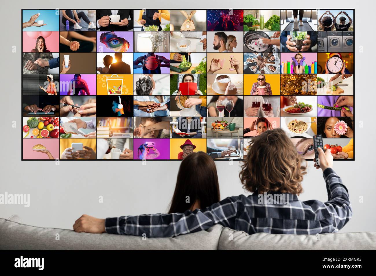 Couple Watching Television With Multiple Channels Displayed on Screen ...