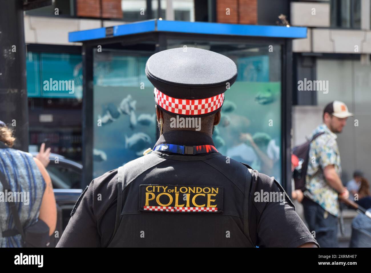 London, UK. 11th August 2024. A police officer observes crowds ...