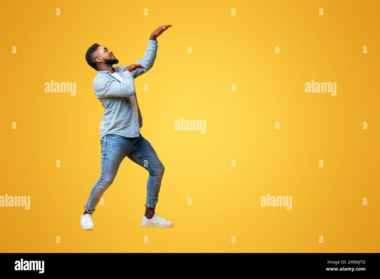 Funny african man having fun and dancing in egypt style Stock Photo - Alamy