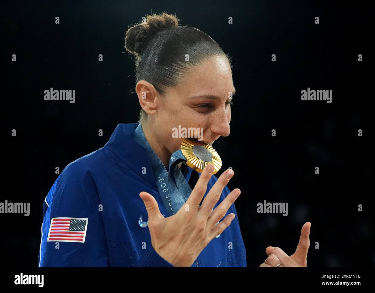Diana Taurasi of the U.S. holds up six fingers to signify the number of ...