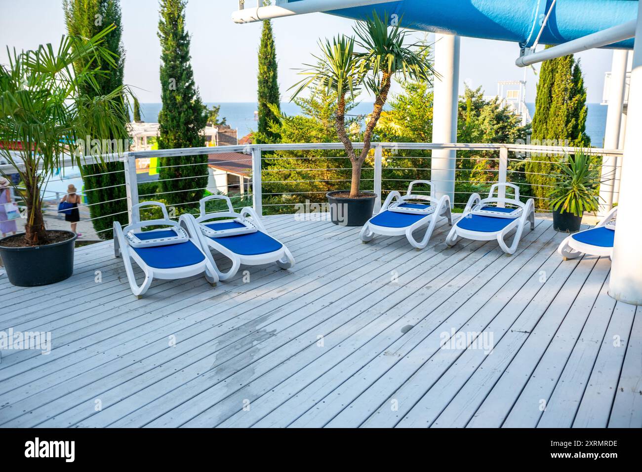 Loungers Deck Poolside Resort - White deck with blue loungers for ...