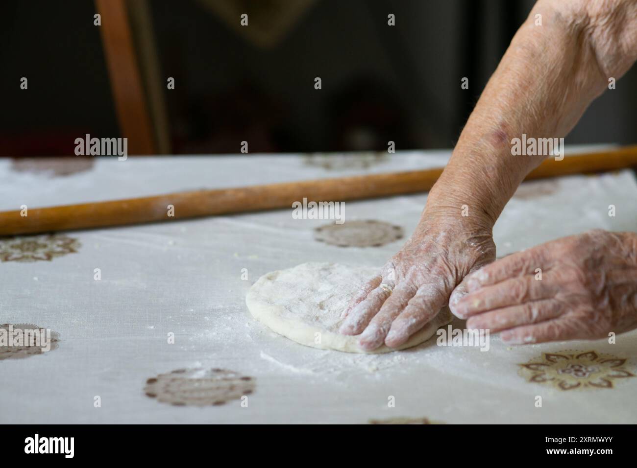 Woman hand kneading dough hi-res stock photography and images - Alamy