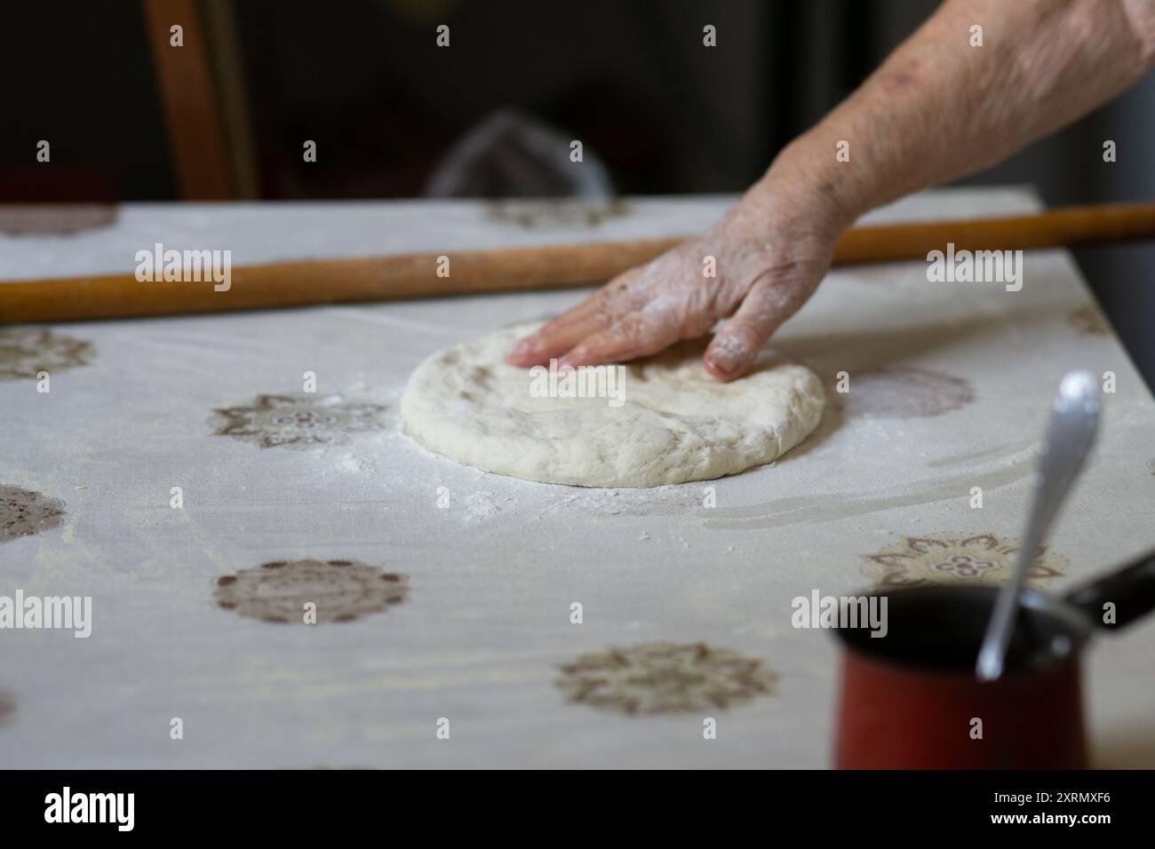 Woman hand kneading dough hi-res stock photography and images - Alamy
