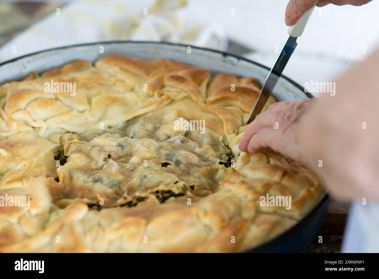 Woman cutting dough pie grandmother hi-res stock photography and images ...