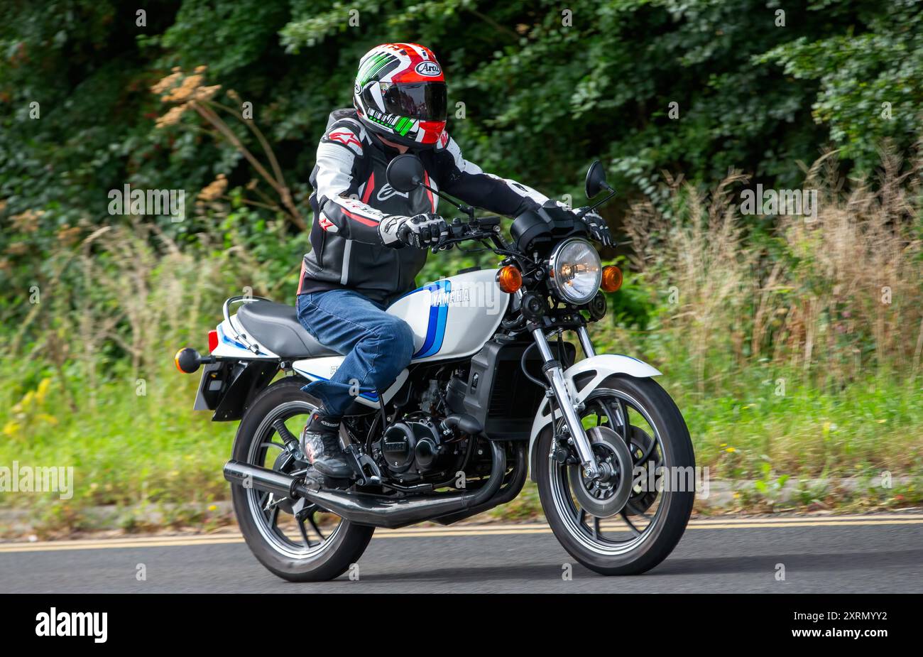 Potterspury,Northants,UK - Aug 11th 2024: Man riding a 1980 white ...