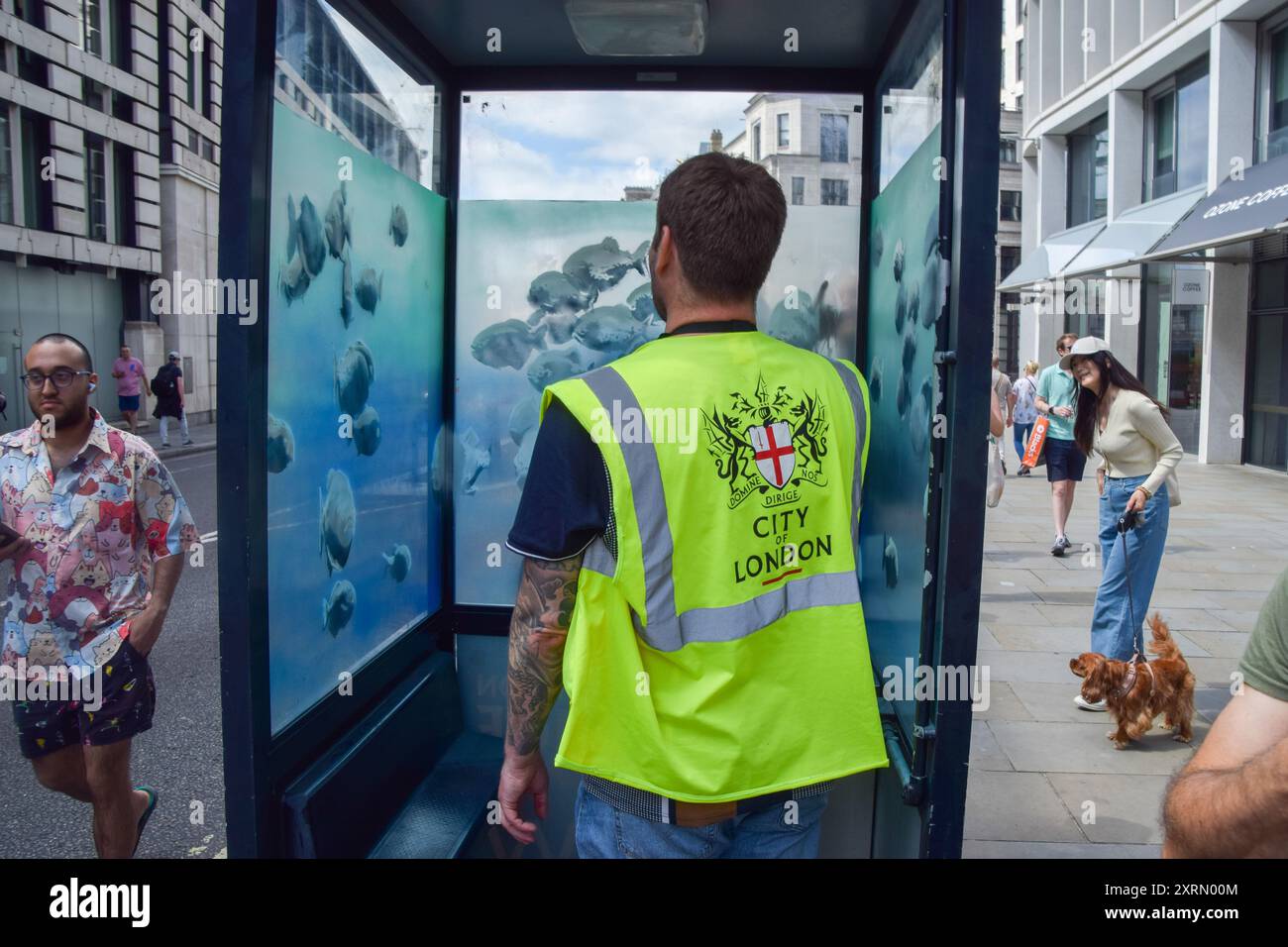 London, England, UK. 11th Aug, 2024. A worker insepcts thepolice sentry ...